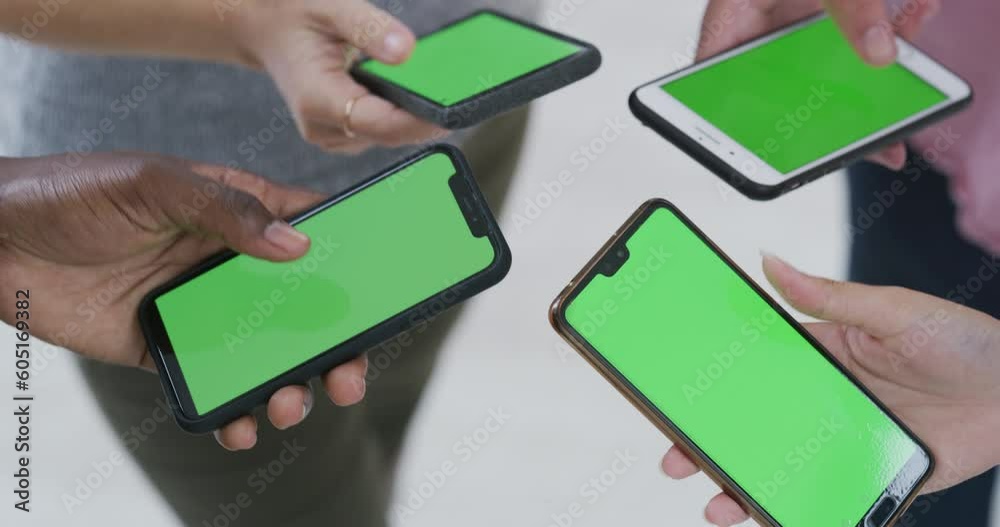 Phone, communication and green screen with people standing in a huddle ...