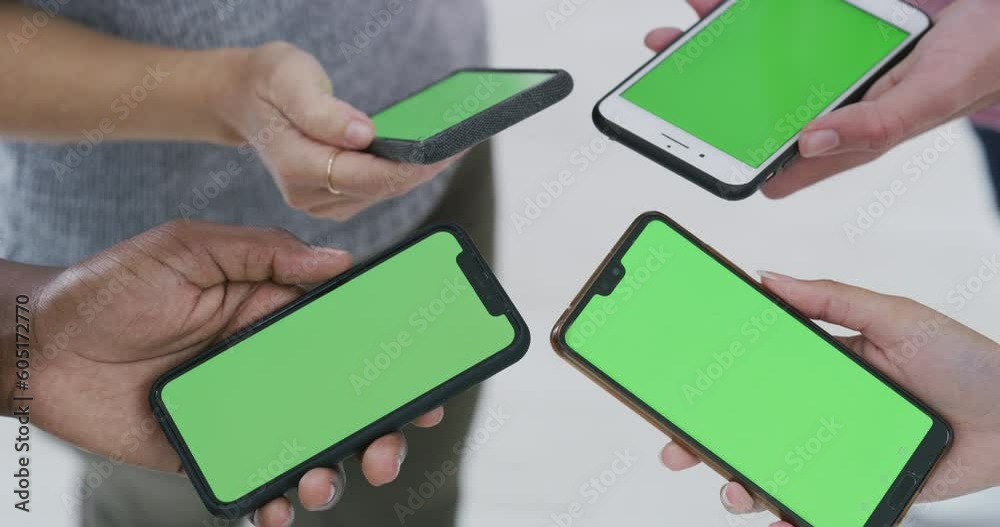Phone, information and green screen with people standing in a huddle to ...