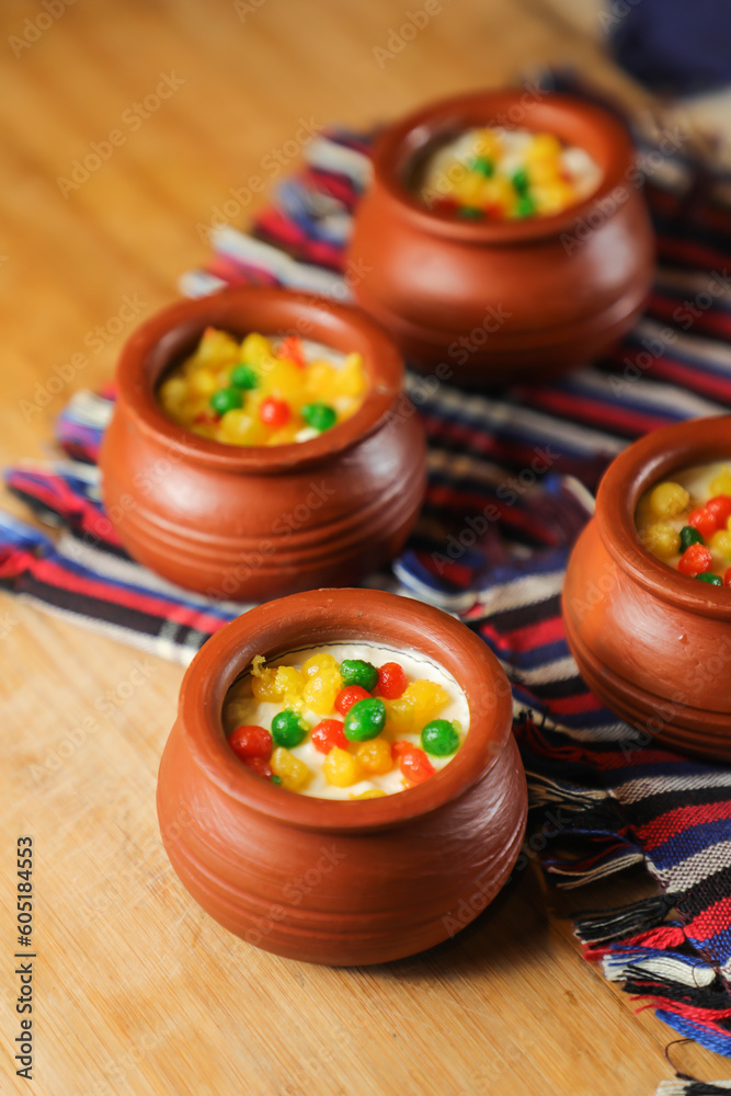 Moondi rabri milk kheer served in pot isolated on mat top view of ...