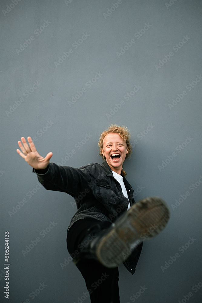 A beautiful, daring girl makes an emotional kick with her foot, so that ...