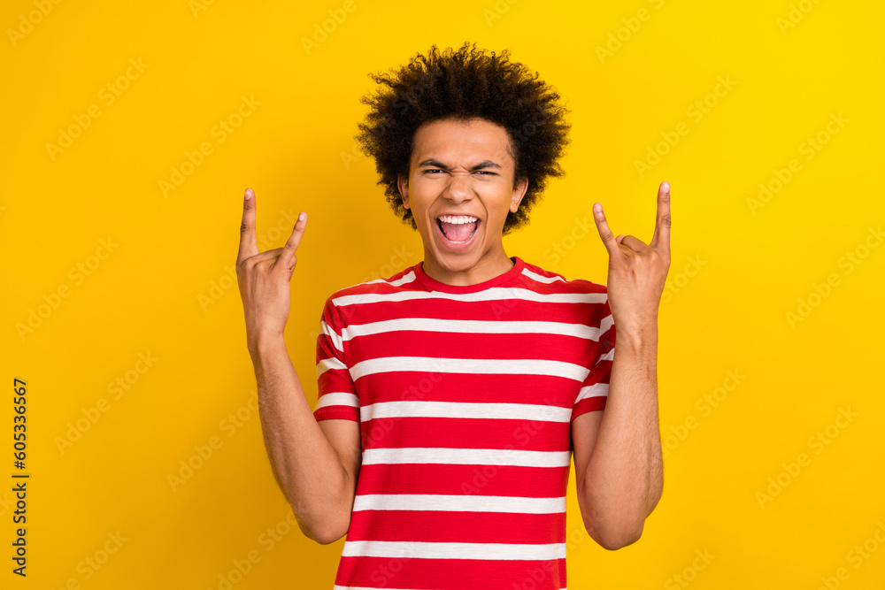 Portrait of overjoyed man open mouth scream fingers show heavy metal ...
