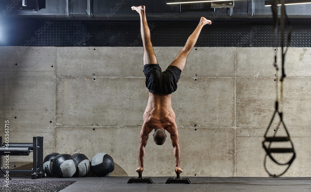 A muscular man in a handstand position, showcasing his exceptional ...