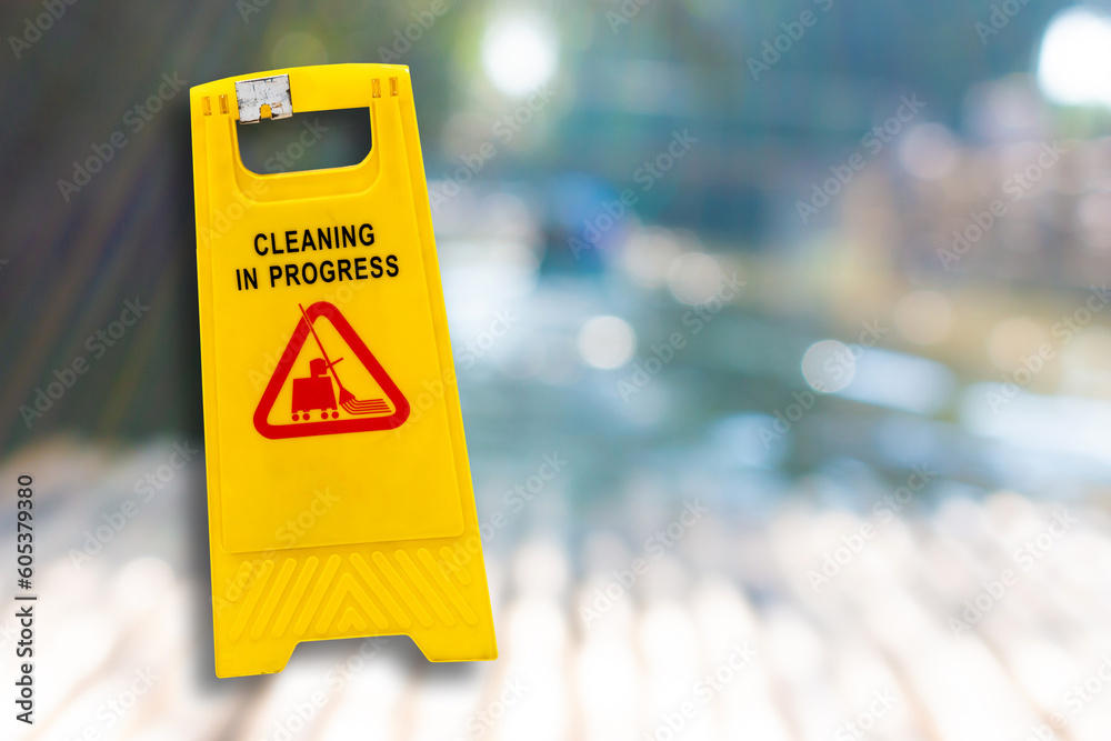 Yellow warning sign with cleaning in progress message with nature ...