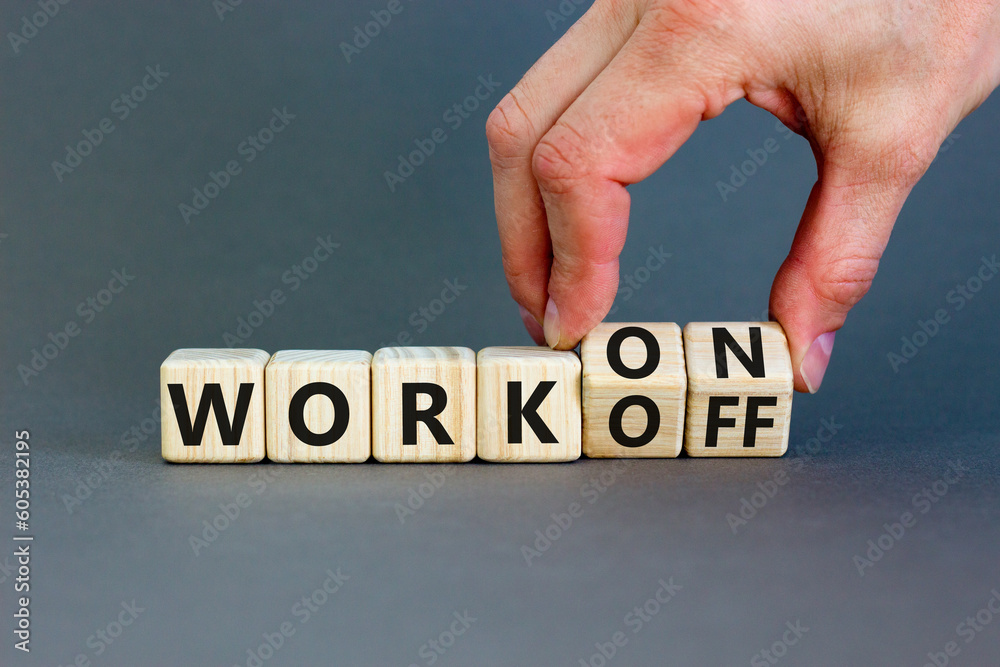 Work on or off symbol. Businessman turns wooden cubes and changes word ...