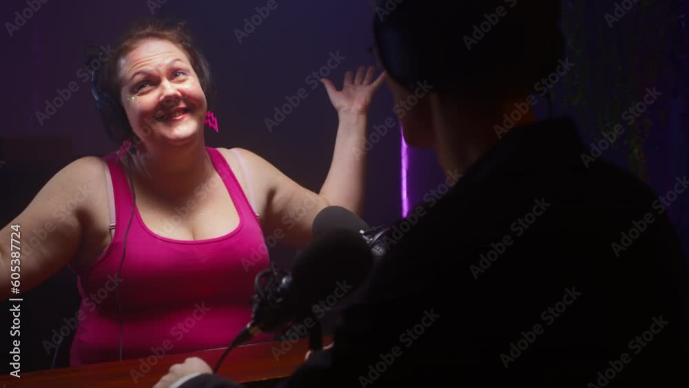 Podcast about body positivity. Chubby fat woman speaks into the ...