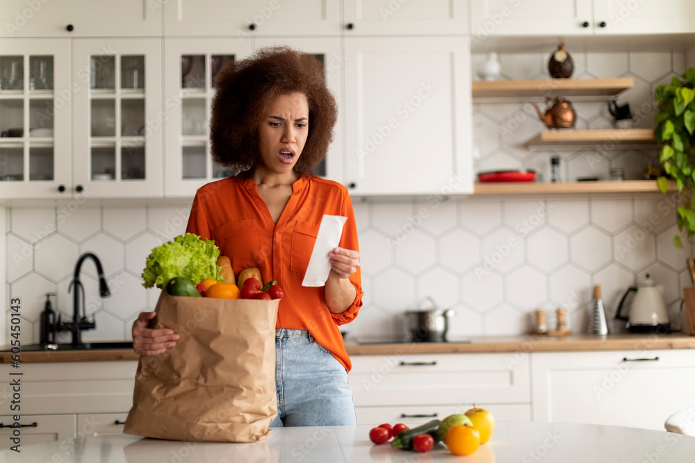 Grocery Expenses. Stressed Black Woman In Kitchen Checking Bill After ...