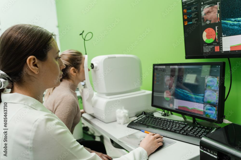 Examination of eyes of patient using optical coherence tomograph ...