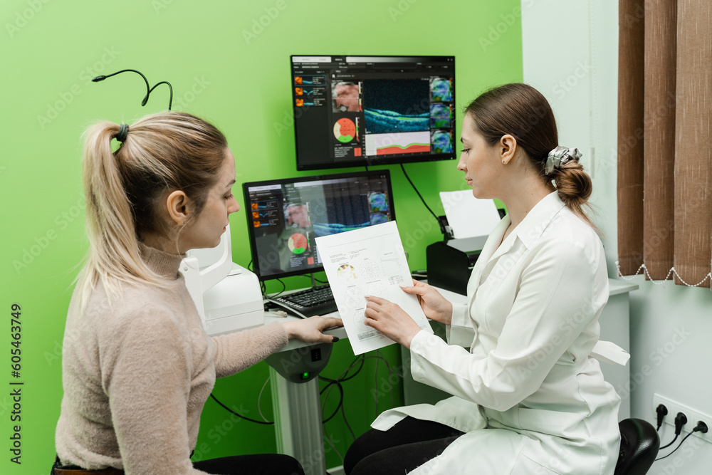 Consultation with optometrist with optical coherence tomography OCT ...