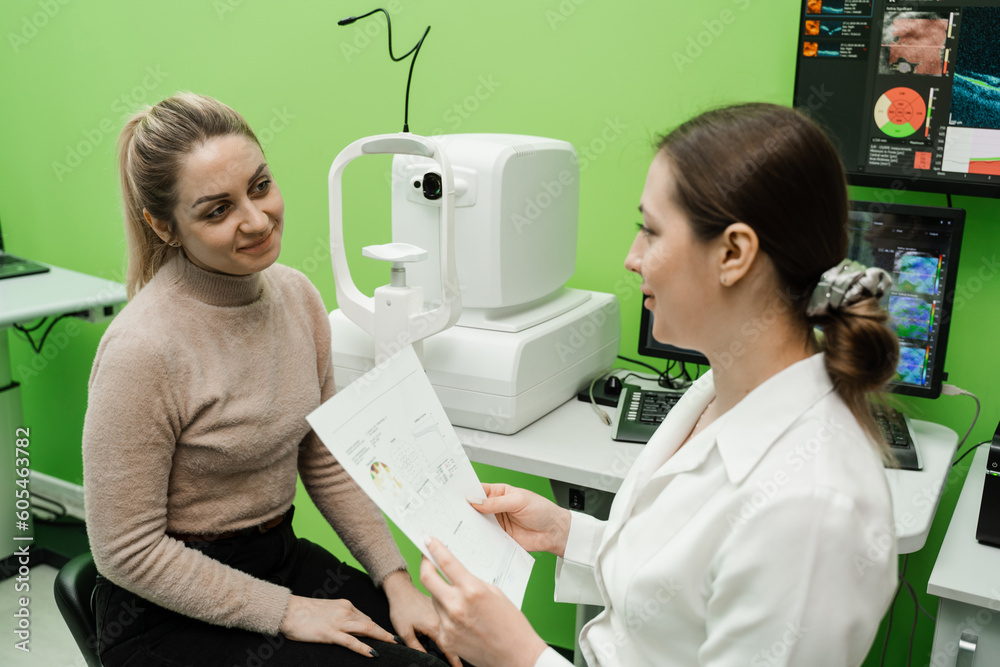 Consultation with optometrist with optical coherence tomography OCT ...