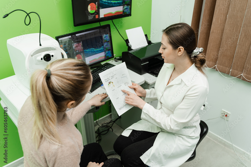 Consultation with optometrist with optical coherence tomography OCT ...