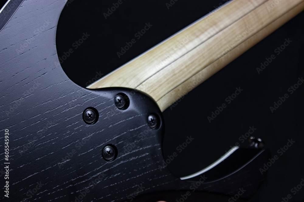 black electric guitar body back with strings and frets with pick up on ...