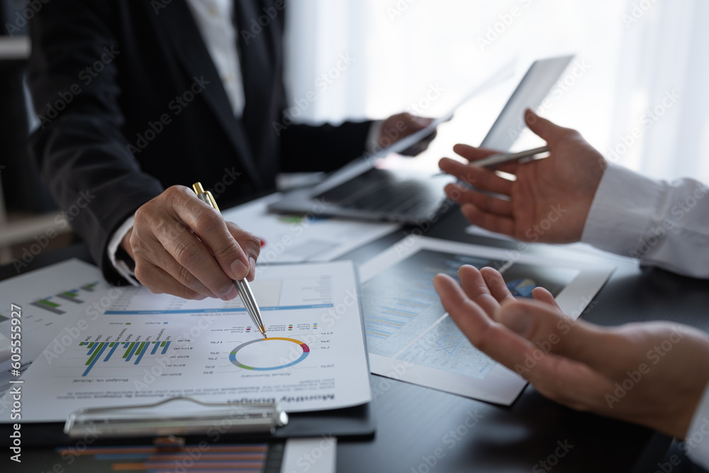 business team brainstorming Discuss the data on earnings charts and ...