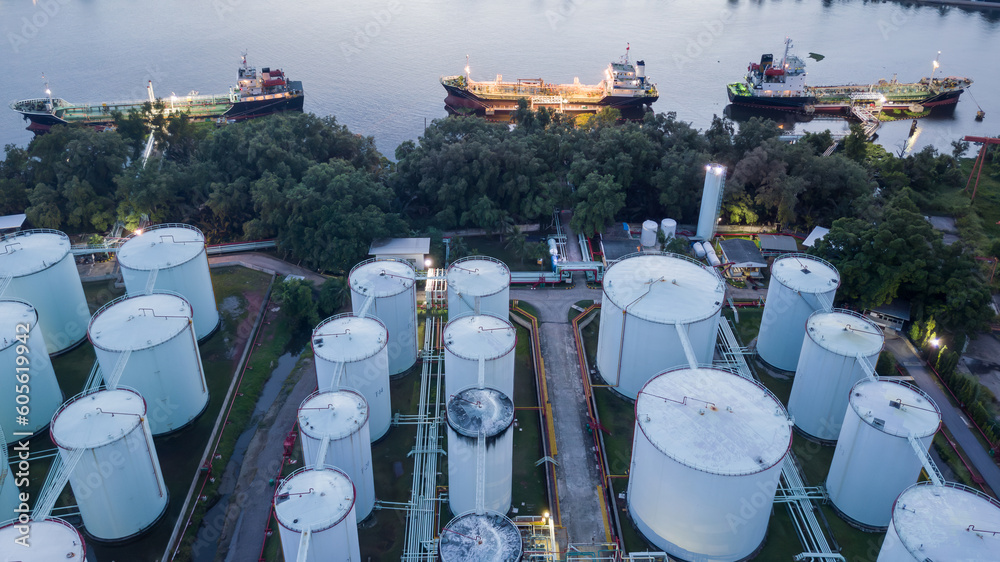 Aerial view oil storage tanks and tanker in river at night, Aerial view ...