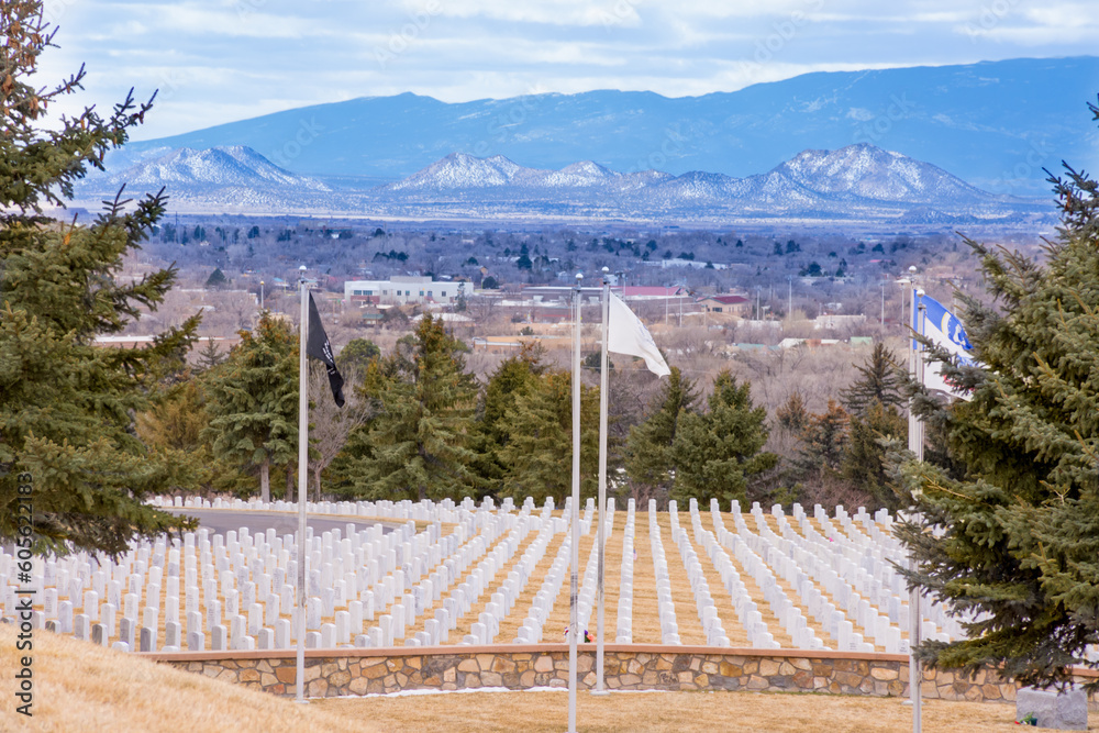 Overlook at Santa Fe National Cemetery showing field of graves, flags ...