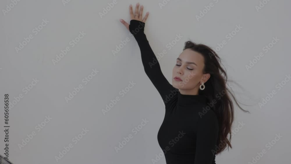 back stage professional female model in black white wall. pretty young ...
