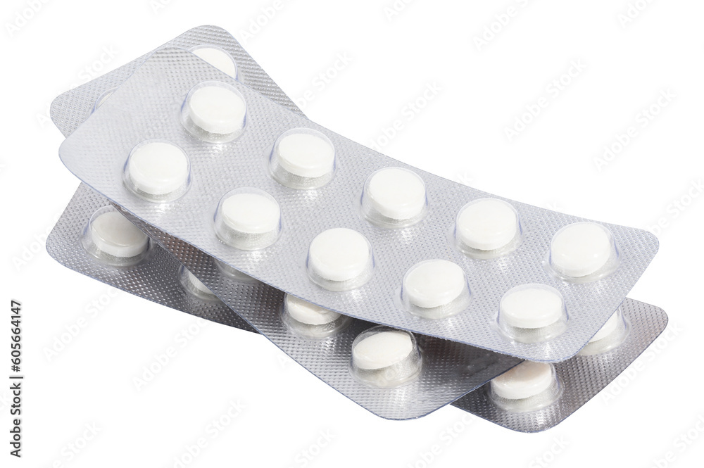 Stack of blister packs with round pills on a white isolated background ...