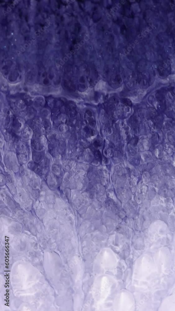 Abstract deep purple, violet and bronze paint, radiating glow. Macro ...