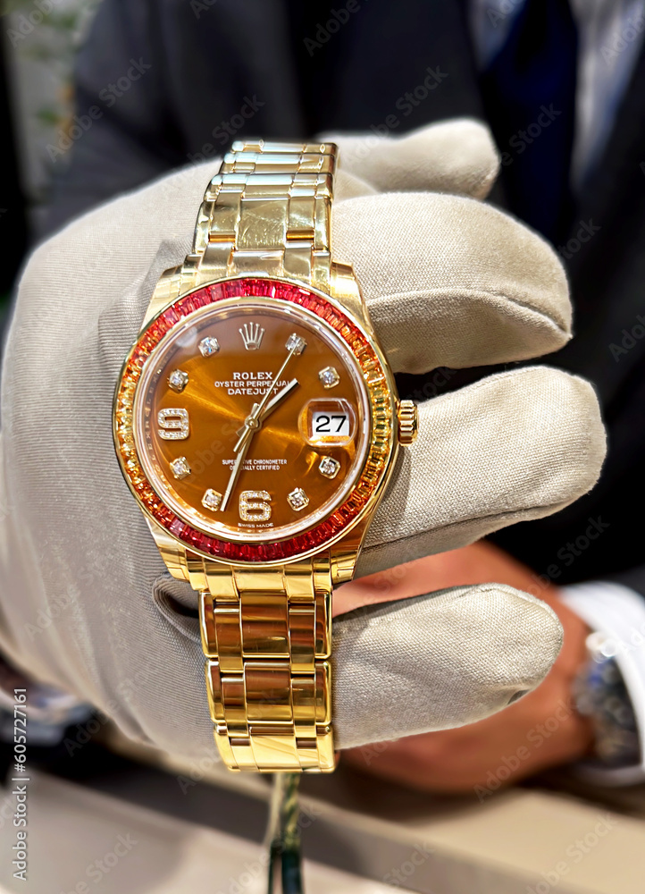 Rolex luxury watch sample. seller shows luxurious Rolex brand watch ...