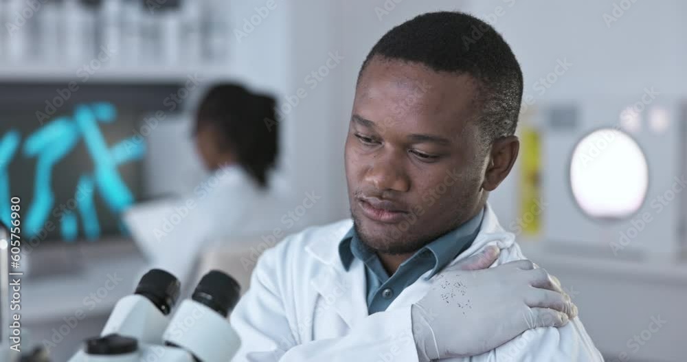 Black man scientist, laboratory microscope and shoulder pain of a ...