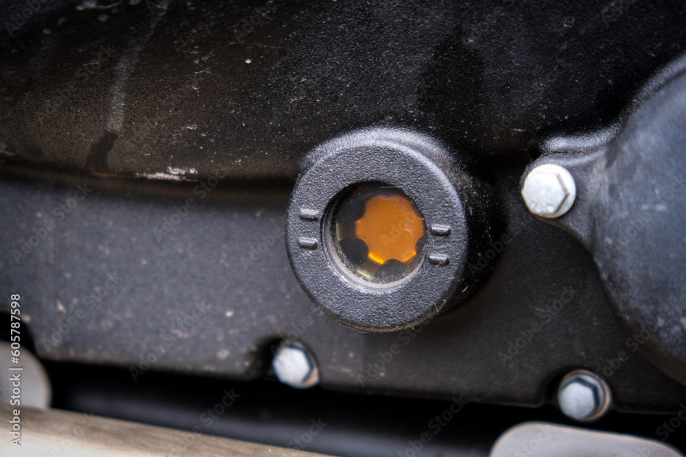 Motorcycle engine oil is seen through the oil level window Stock Photo ...