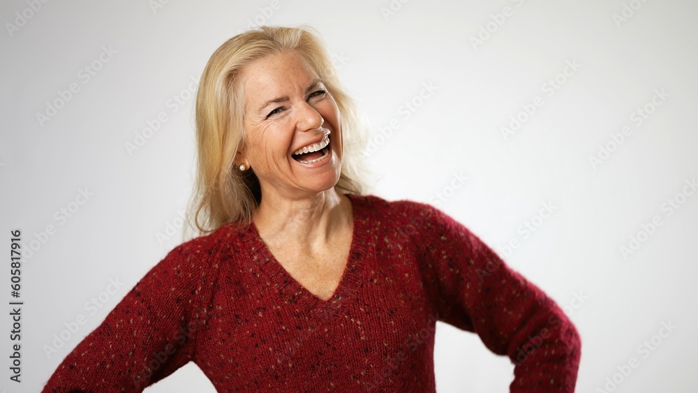 Laughing out loud portrait of happy smiling beautiful 50s middle aged ...