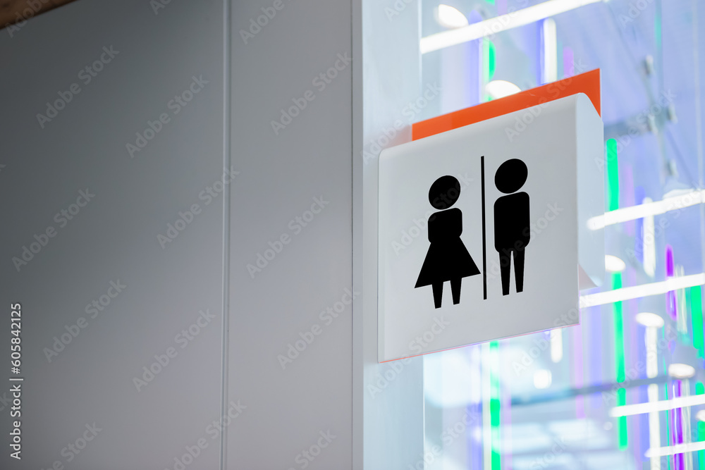 White public toilet sign hanging on wall indoors Stock Photo | Adobe Stock