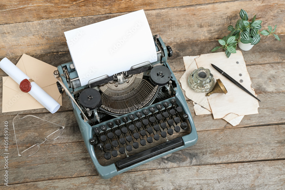 Vintage typewriter, inkwell, eyeglasses and scroll with wax seal stamp ...