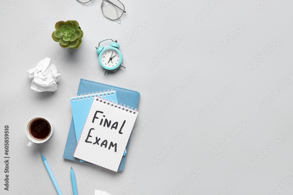 Notebooks with text FINAL EXAM, cup of coffee and mini alarm clock on ...