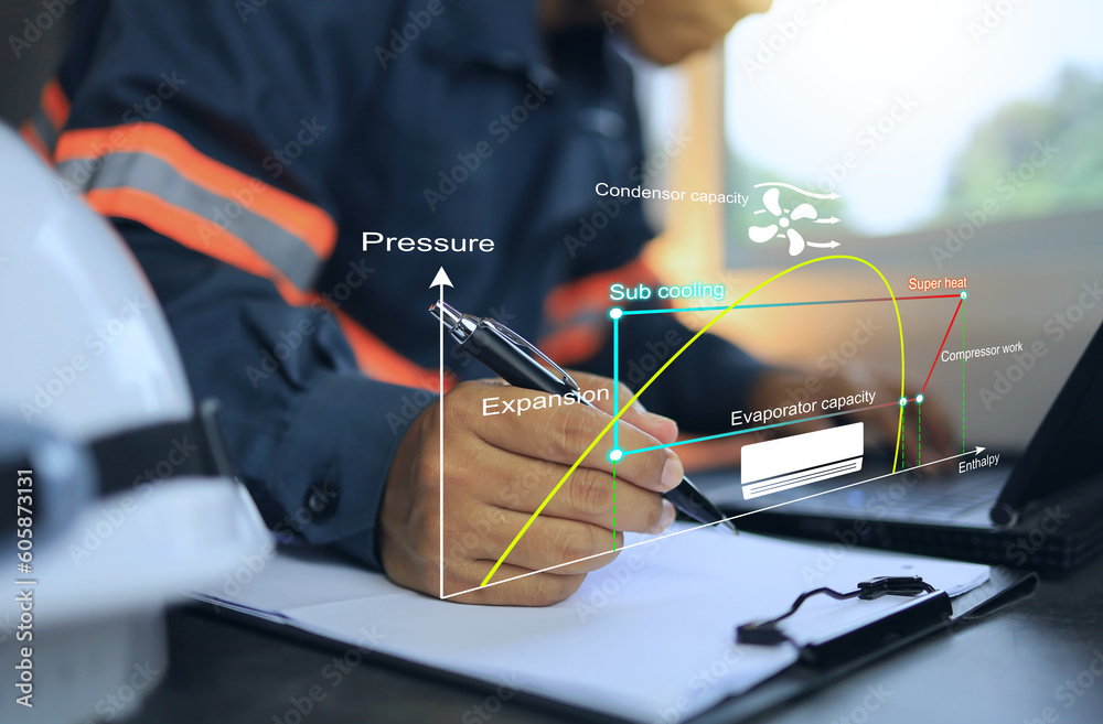 Air conditioner engineer using computer for cooling system design with ...