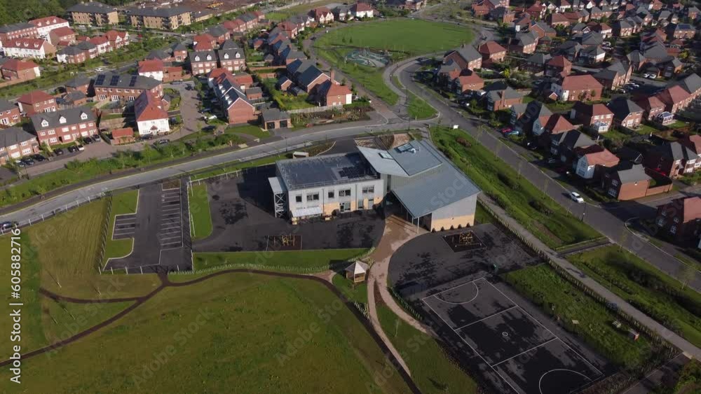 Drone aerial view of new middle-class housing estate and new eco-school ...