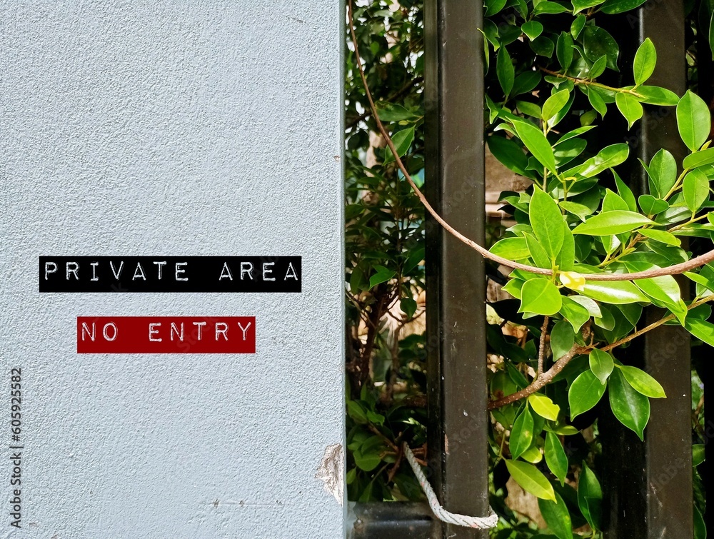 Wall background with text sign PRIVATE AREA NO ENTRY - residents and ...