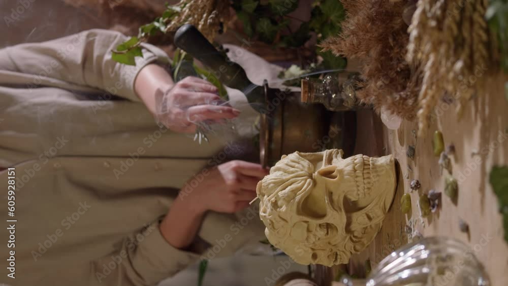 A vertical shot of a woman performing occult rituals. Occult and ...