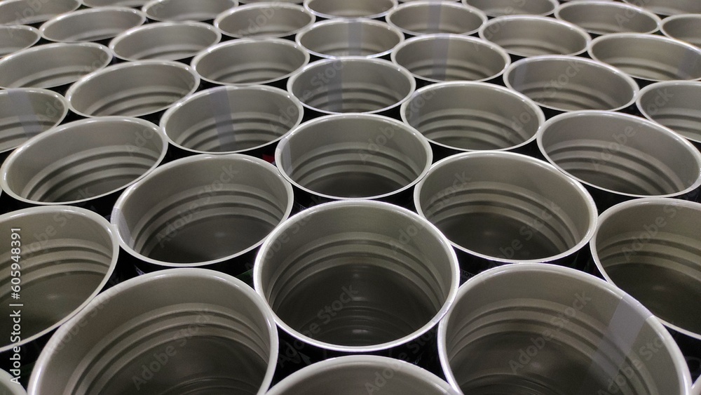 Empty can on running conveyor of machine during production time in ...