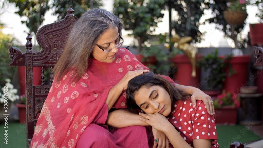 A middle-aged Indian lady consoling her daughter - caring mother love ...