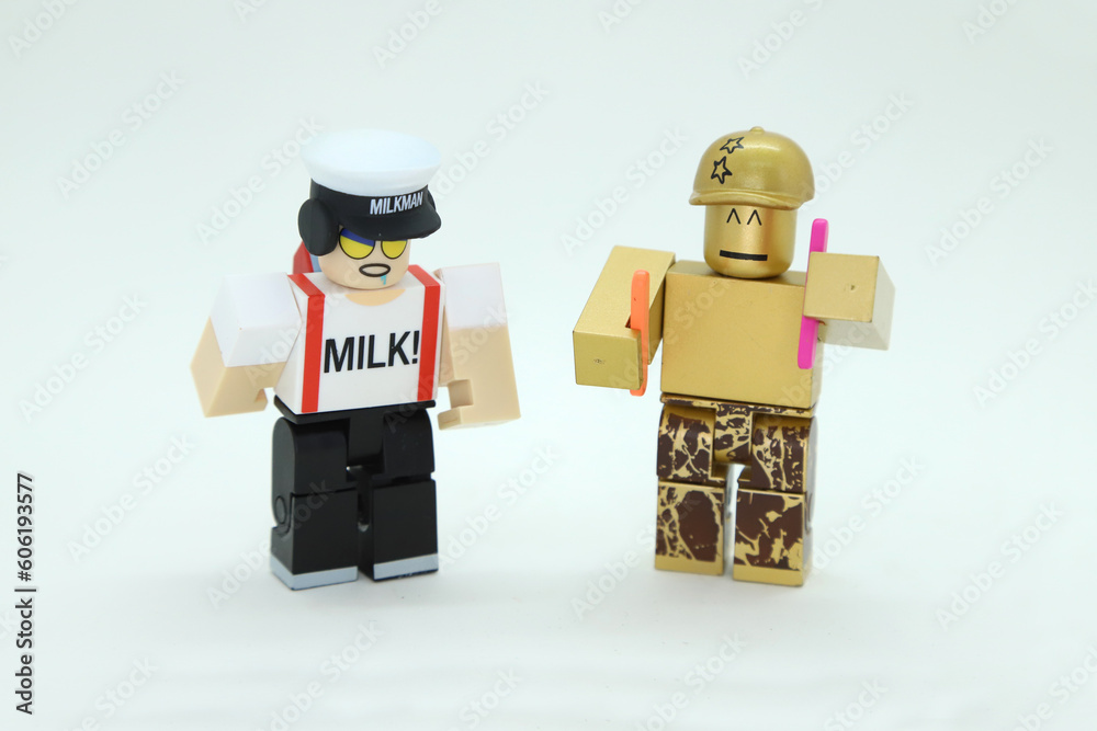 Characters dolls from the video game Roblox in gold color boy and ...