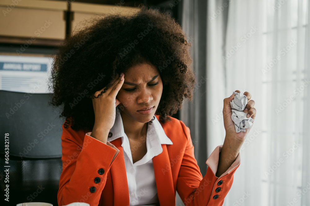Tired african american business woman working with audit, balance sheet ...