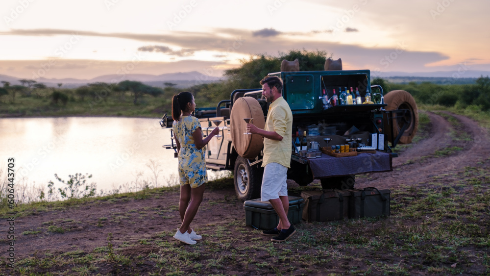 Asian women and European men on safari game drive in South Africa ...