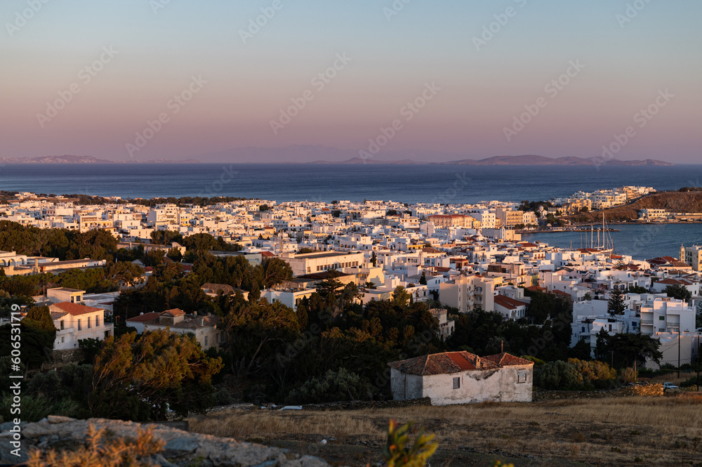 View on the city of Tinos from the hill during sunset. City centre and ...