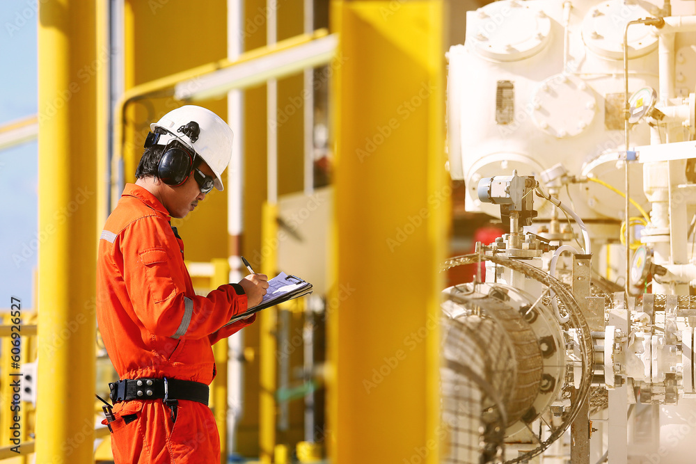 operator recording operation of oil and gas process at oil and rig ...