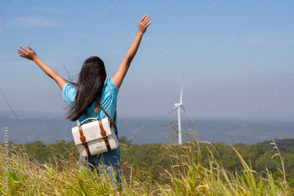 Traveler girl turn back looking beautiful view of mountain and Wind ...