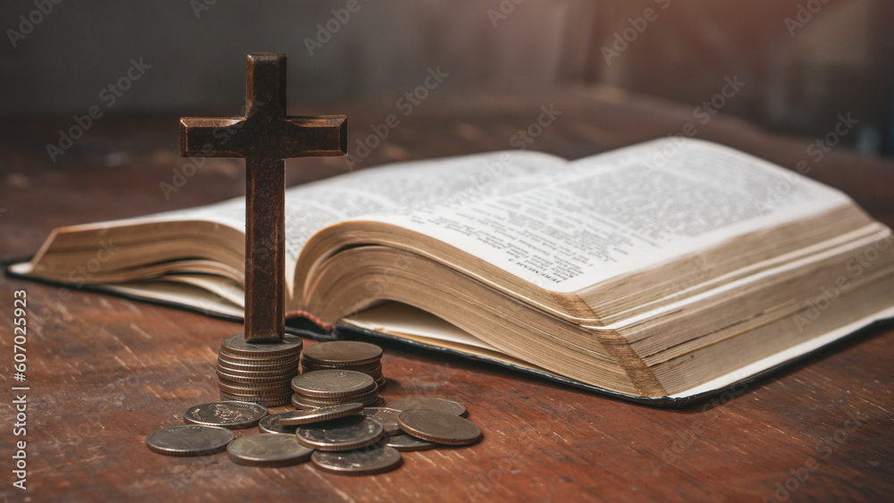 Tithe concept. Cross and coins with Holy Bible. Biblical concept of ...
