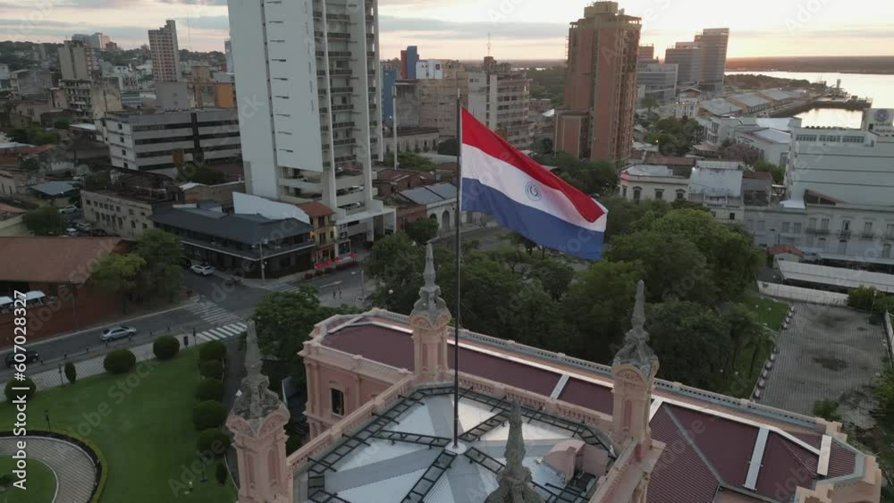 Paraguay flag waving at wind above Palacio de López in the capital city ...