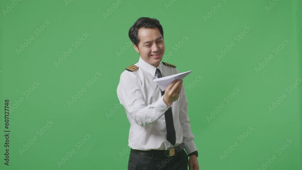 Asian Man Pilot In Professional Uniform Launching Paper Plane, Holding ...