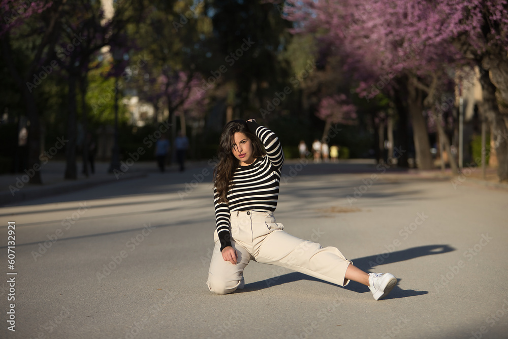 Young and beautiful woman, Hispanic, brown hair, with striped sweater ...