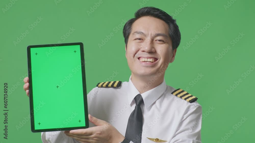 Vidéo Stock Close Up Of Asian Man Pilot Smiling And Showing Green ...