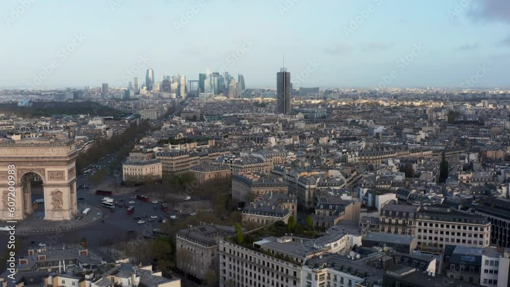 Flying slowly above Paris old town buildings to reveal Arc de Triomphe ...