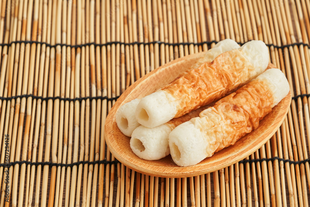 Chikuwa Takebue bake fish cake japanese food in wood plate on bamboo ...