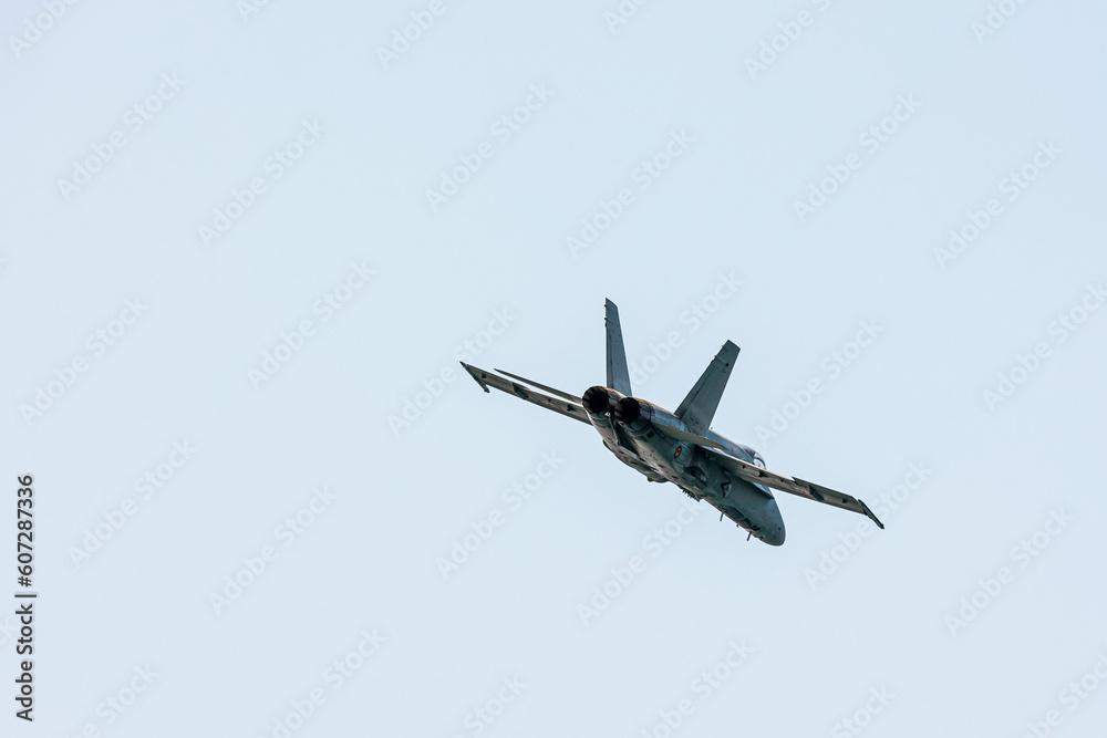 Rear view of a hornet F-18 jet fighter in an Air show festival flying ...