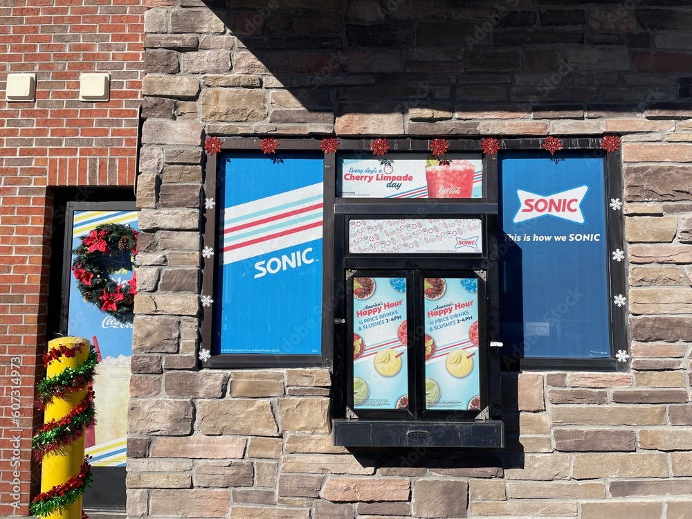 Sonic Fast food drive thru window and holiday signage Stock Photo ...