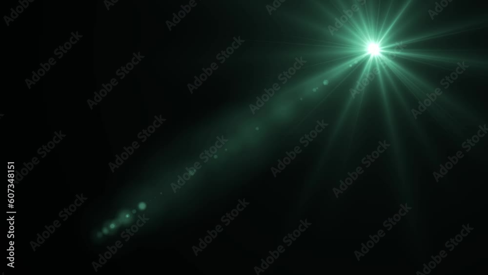 Optical Lens flare effect, green on black background. Moving from left ...